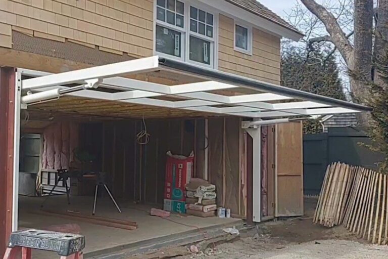 Tilt-up Luxury Garage Doors | Hydraulic Swing Out System